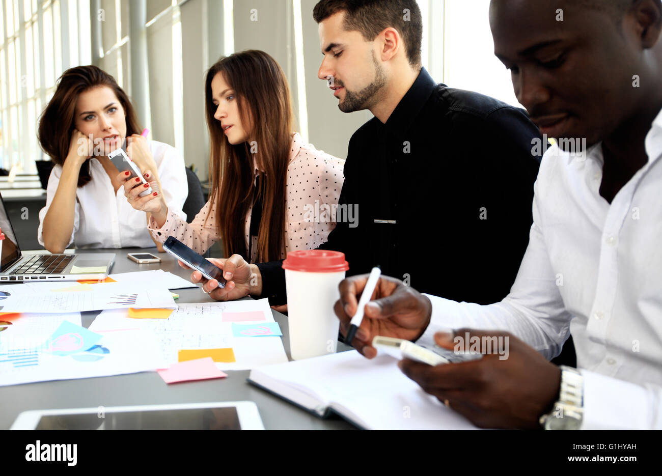 Business team discussing together business plans Stock Photo - Alamy