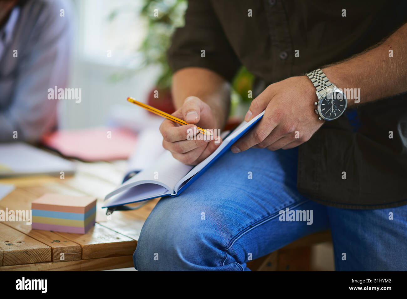 Male hands taking notes Stock Photo - Alamy