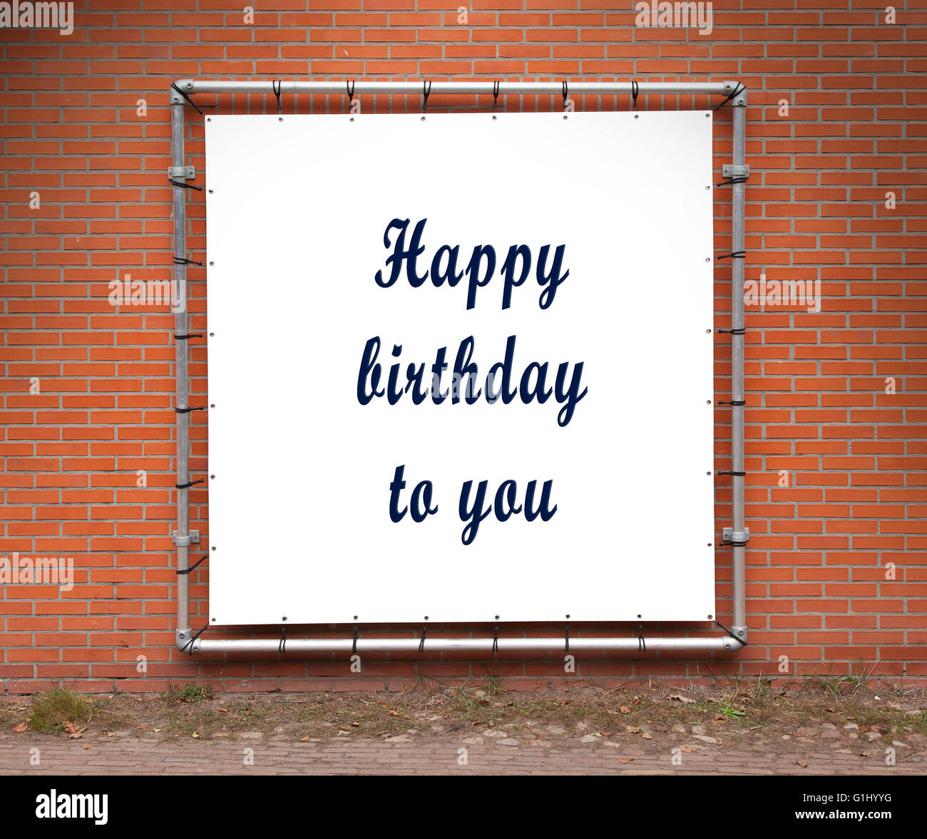 Large banner with inspirational quote on a brick wall - Happy birthday ...
