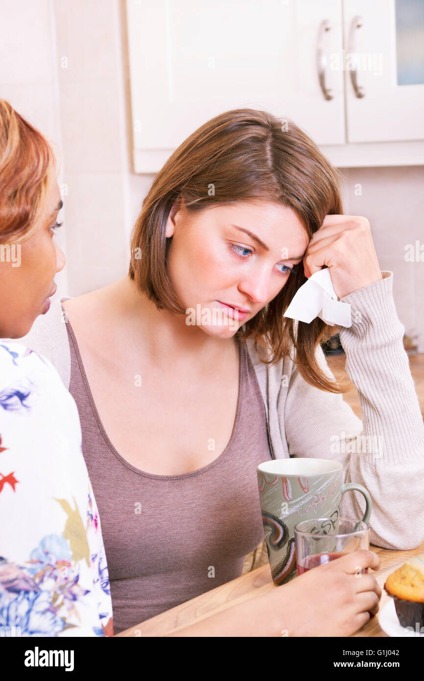Sad young woman being comforted by friends Stock Photo - Alamy Sad young woman being comforted by friends Stock Photo - Alamy