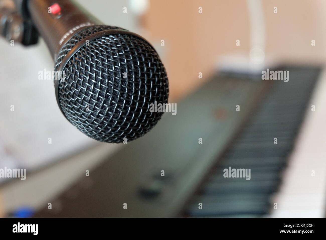 A microphone with keyboard background Stock Photo - Alamy