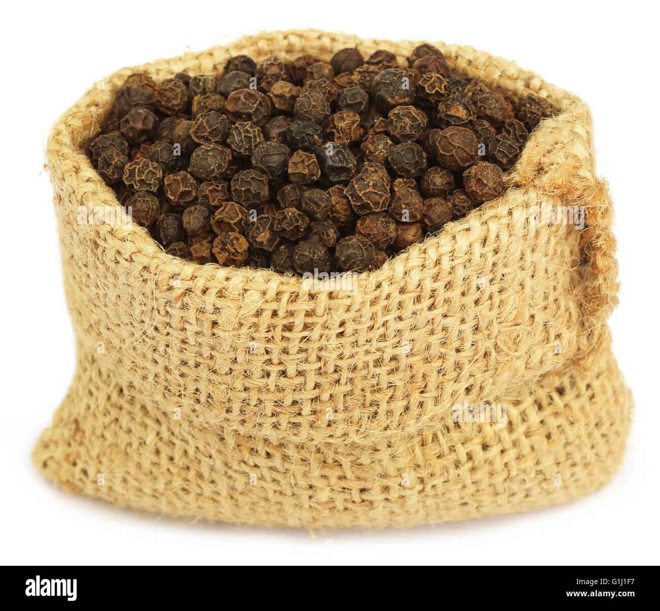 Black peppers on sack over white background Stock Photo - Alamy