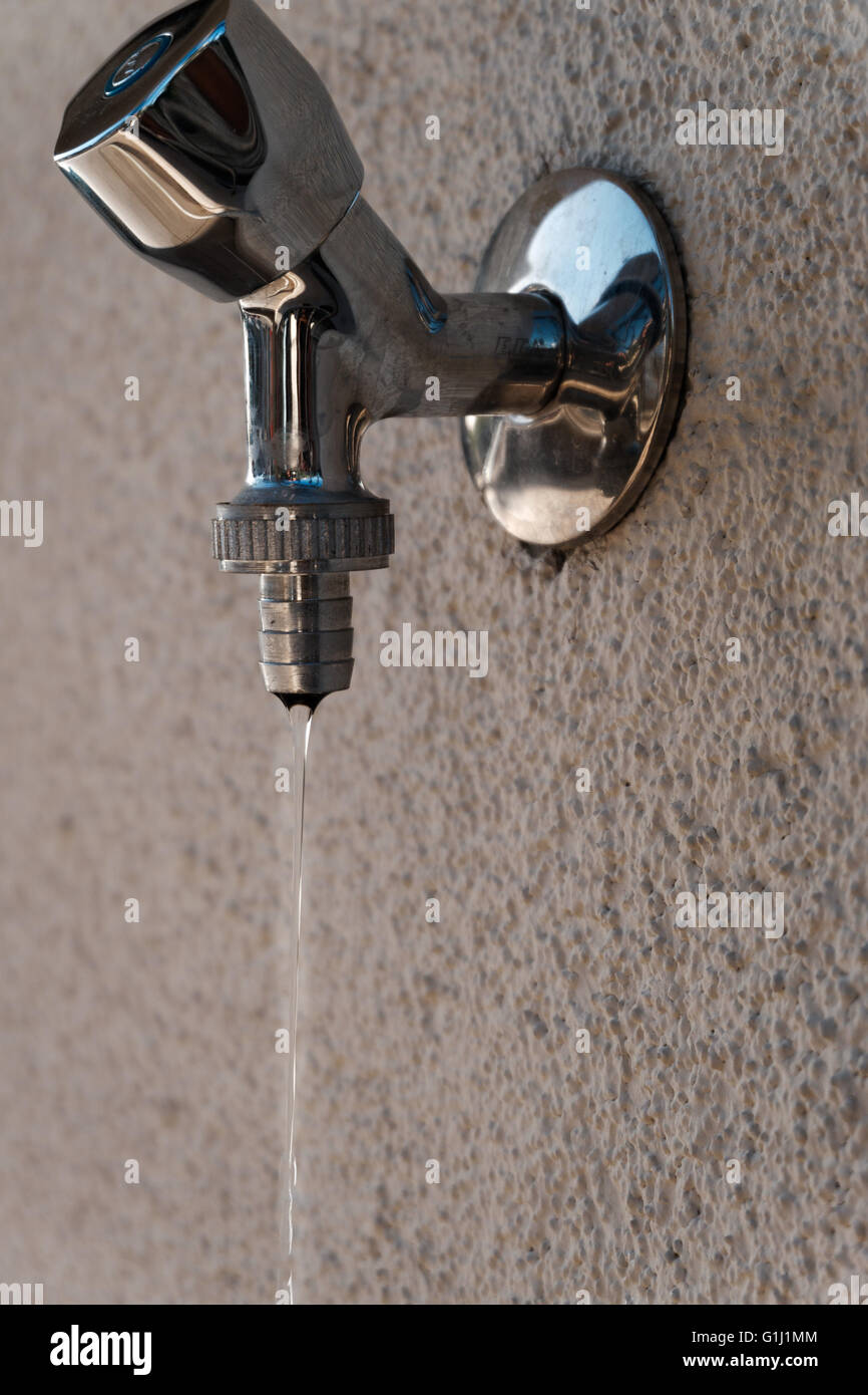 Water on a wall with water flowing Stock Photo - Alamy