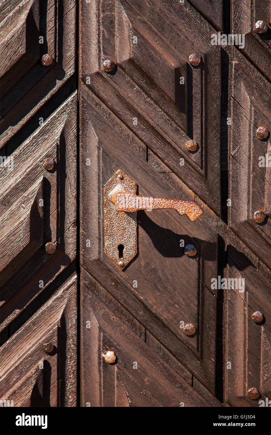 Image of rnate old door with metal rivets and handle Stock Photo - Alamy