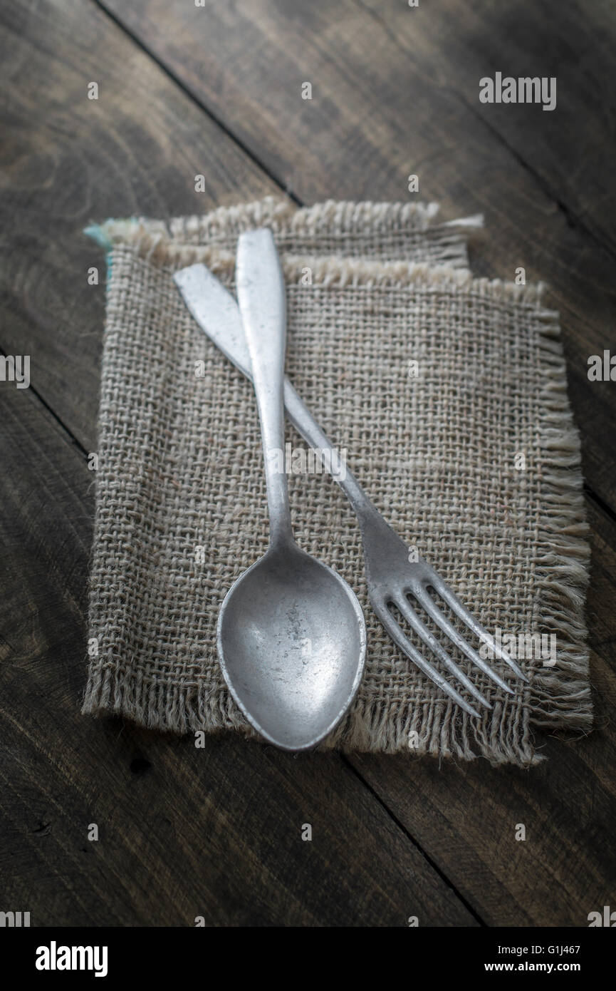 Old cutlery on wooden table, close up Stock Photo - Alamy