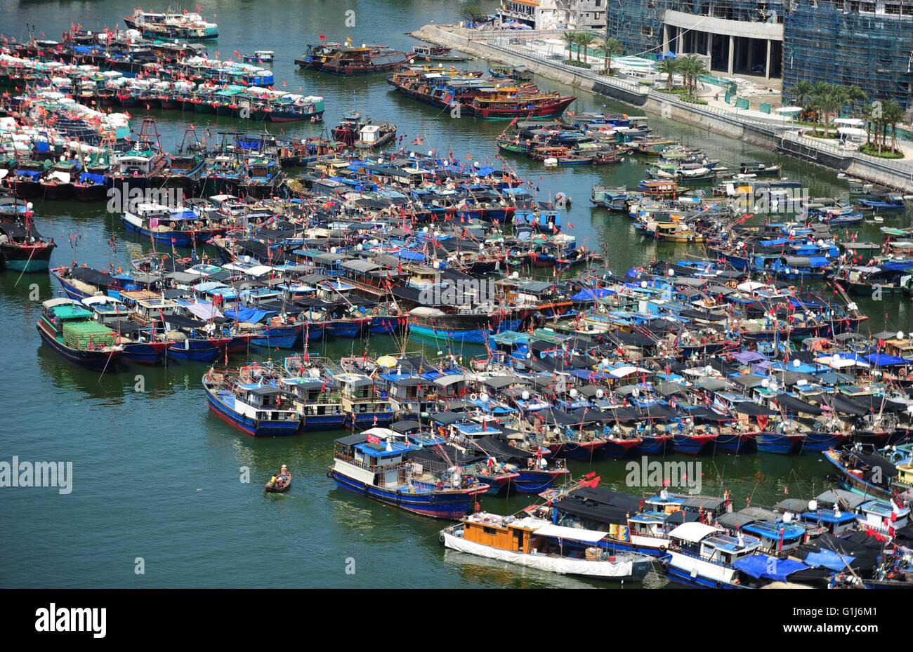 Sanya, China's Hainan Province. 16th May, 2016. Fishing boats berth at ...