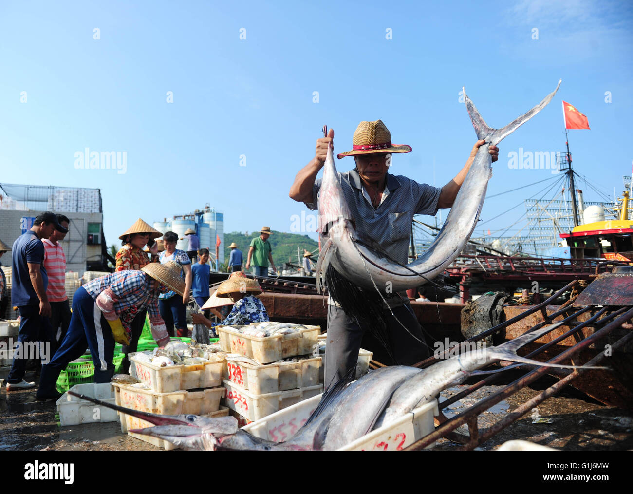 Sanya, China's Hainan Province. 16th May, 2016. Fishermen deal with the ...