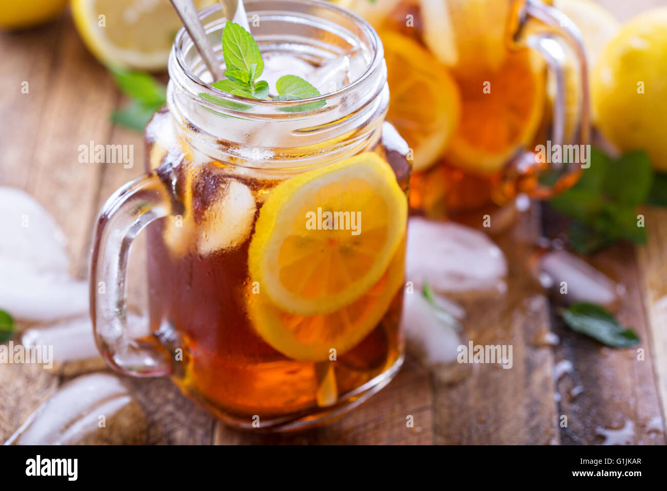 Iced tea with lemon slices Stock Photo - Alamy