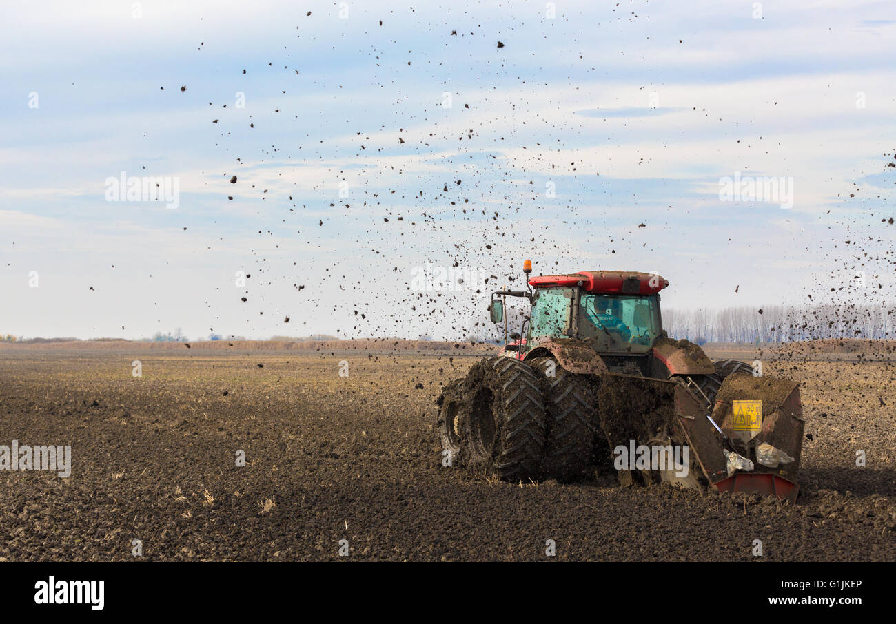 Tractor with double wheeled ditcher digging drainage canal Stock Photo ...