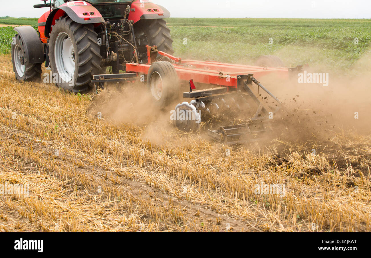 Tractor cultivating wheat stubble field, crop residue Stock Photo - Alamy