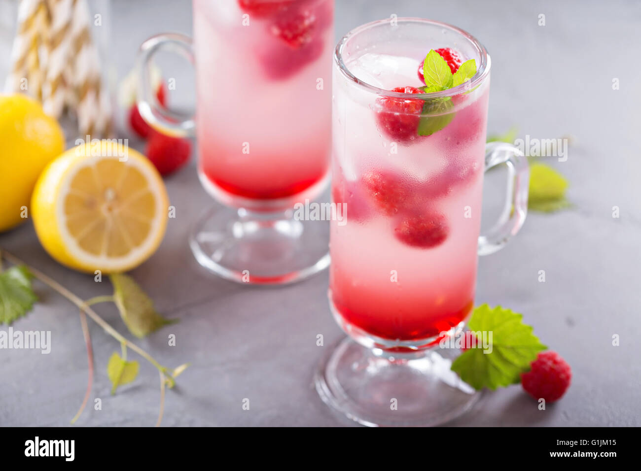 Pink raspberry lemonade in tall glasses Stock Photo - Alamy