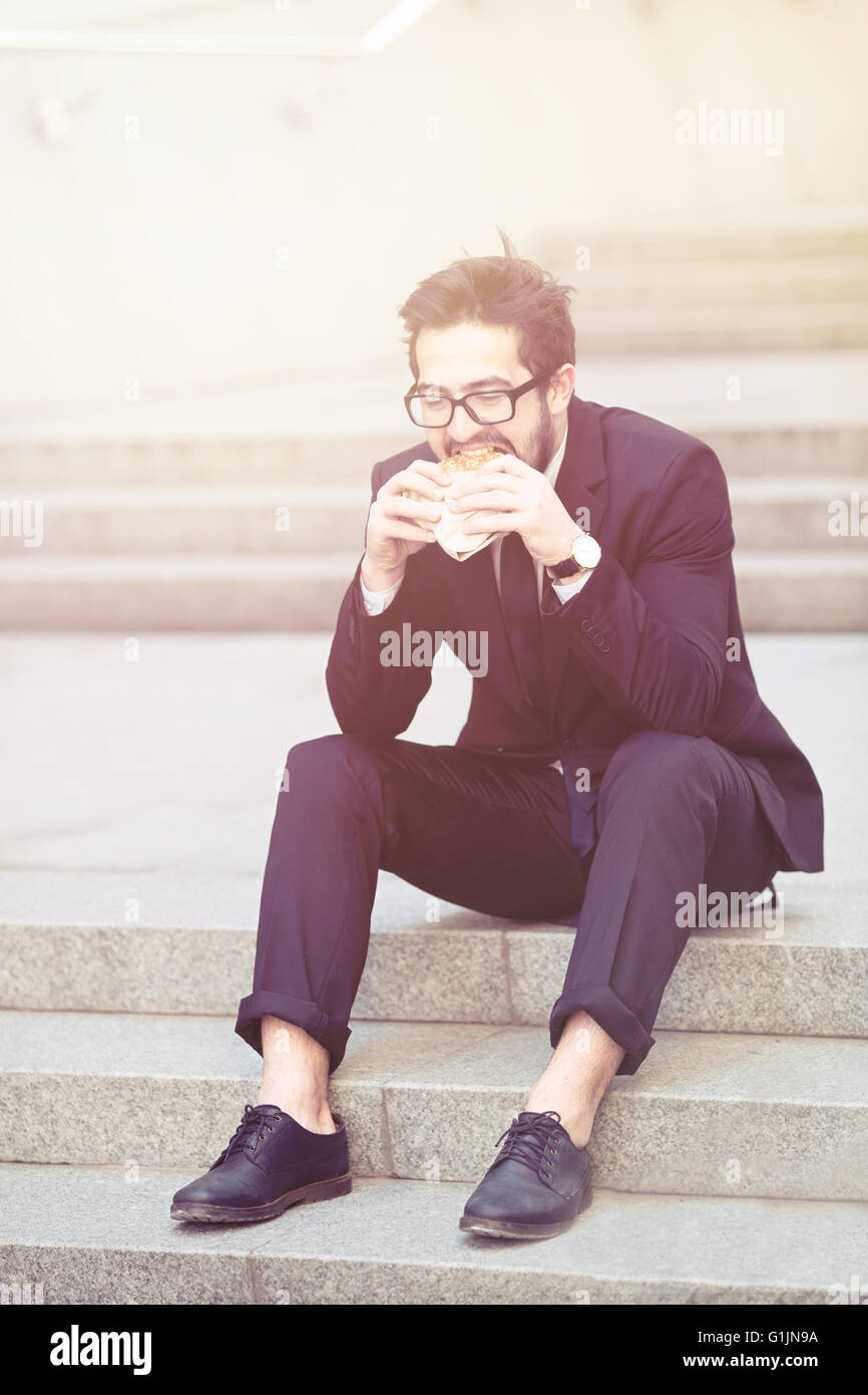 Concept food man eating sandwich hi-res stock photography and images ...