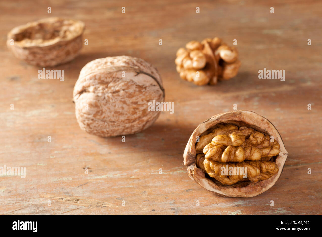 Cracked walnut on table top Stock Photo - Alamy
