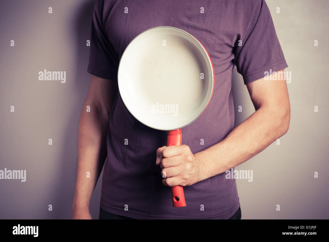 Chef cook holding pan hi-res stock photography and images - Alamy