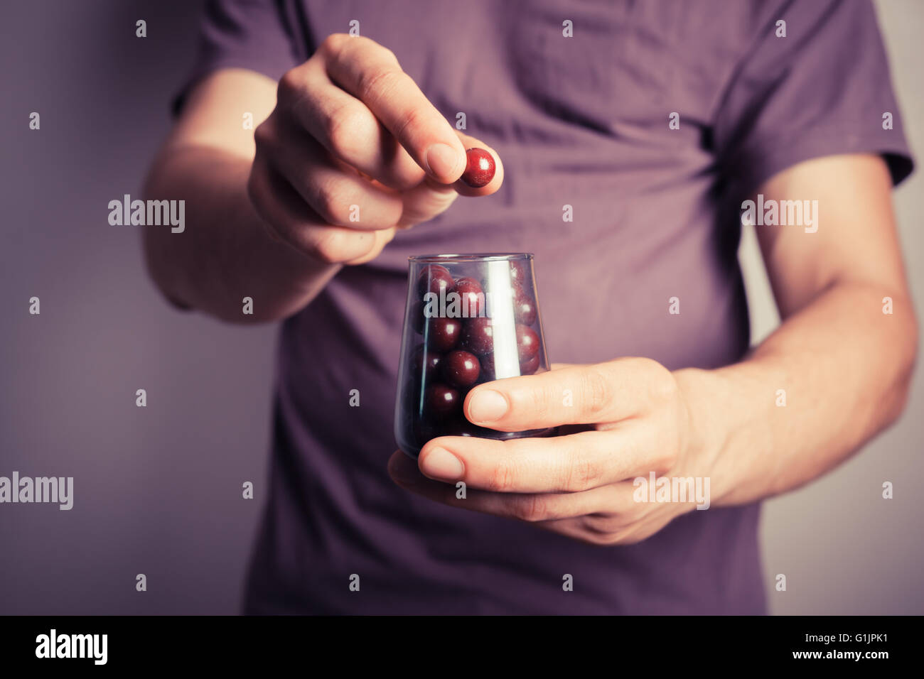 Man holding candy hi-res stock photography and images - Alamy
