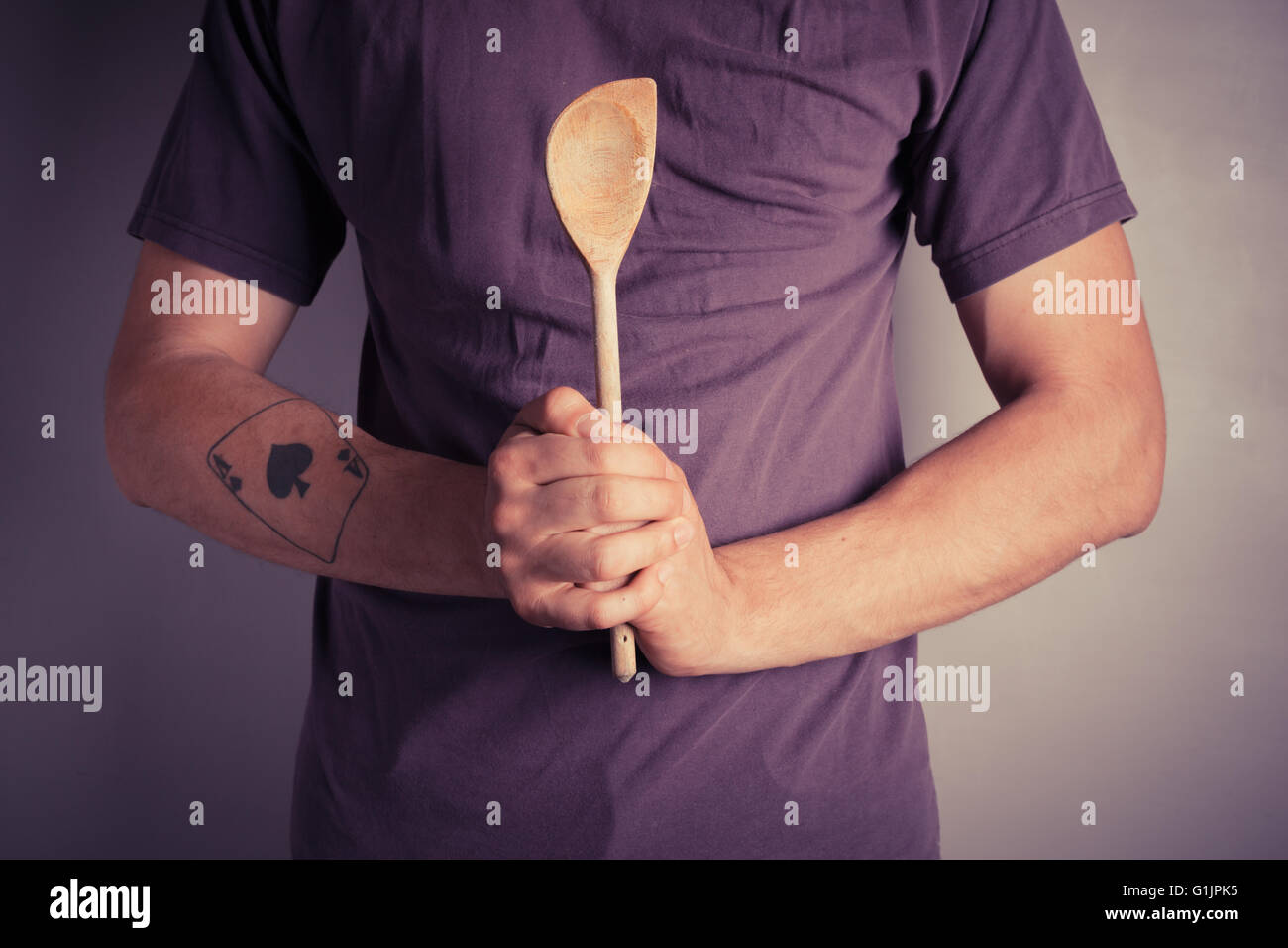 Man holding a spoon hi-res stock photography and images - Alamy