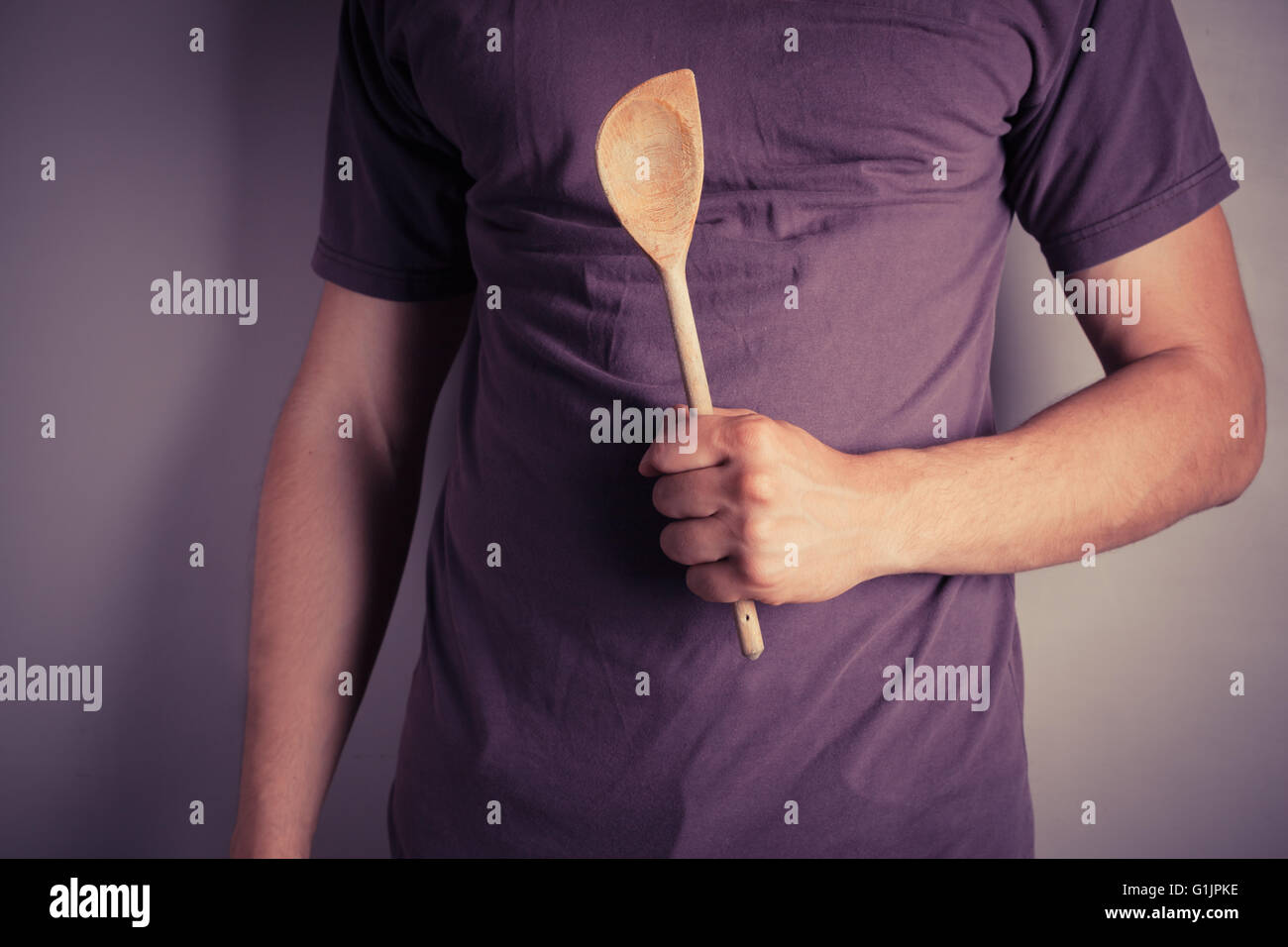 Man holding a spoon hi-res stock photography and images - Alamy