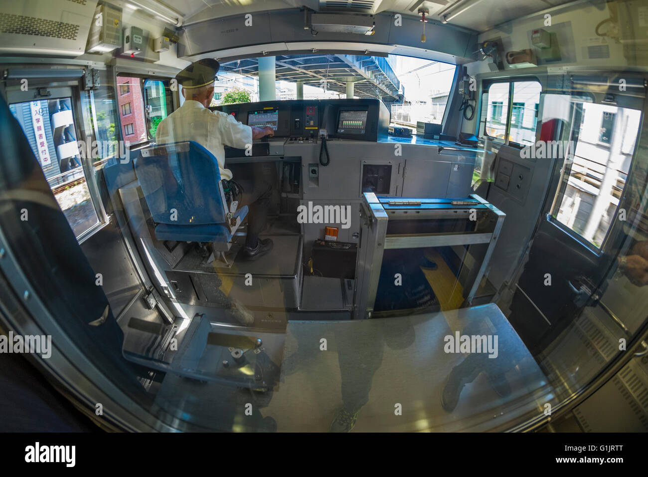 A Japanese train driver in a train cockpit Stock Photo - Alamy