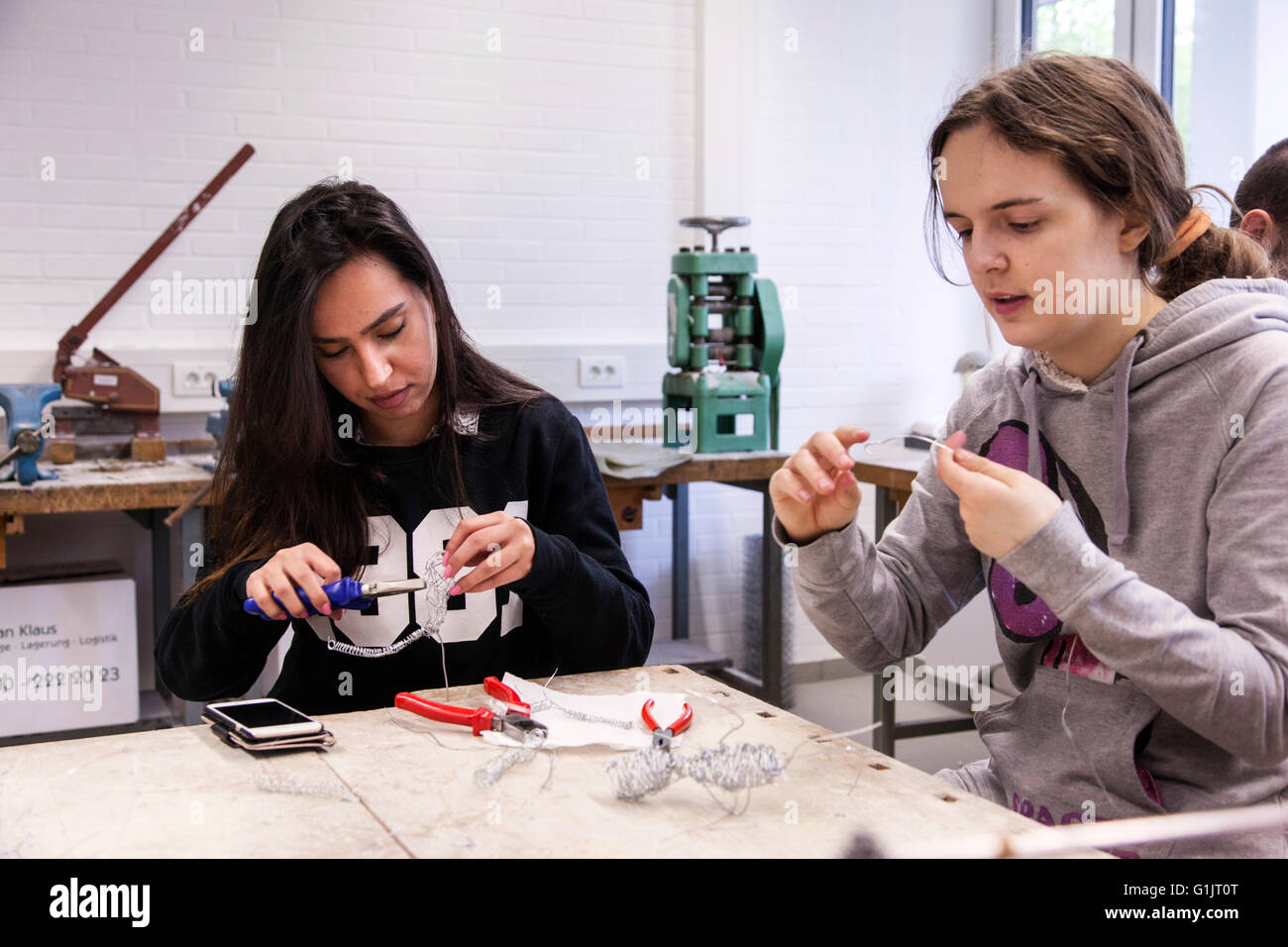 Students in art class create a work of art Stock Photo - Alamy