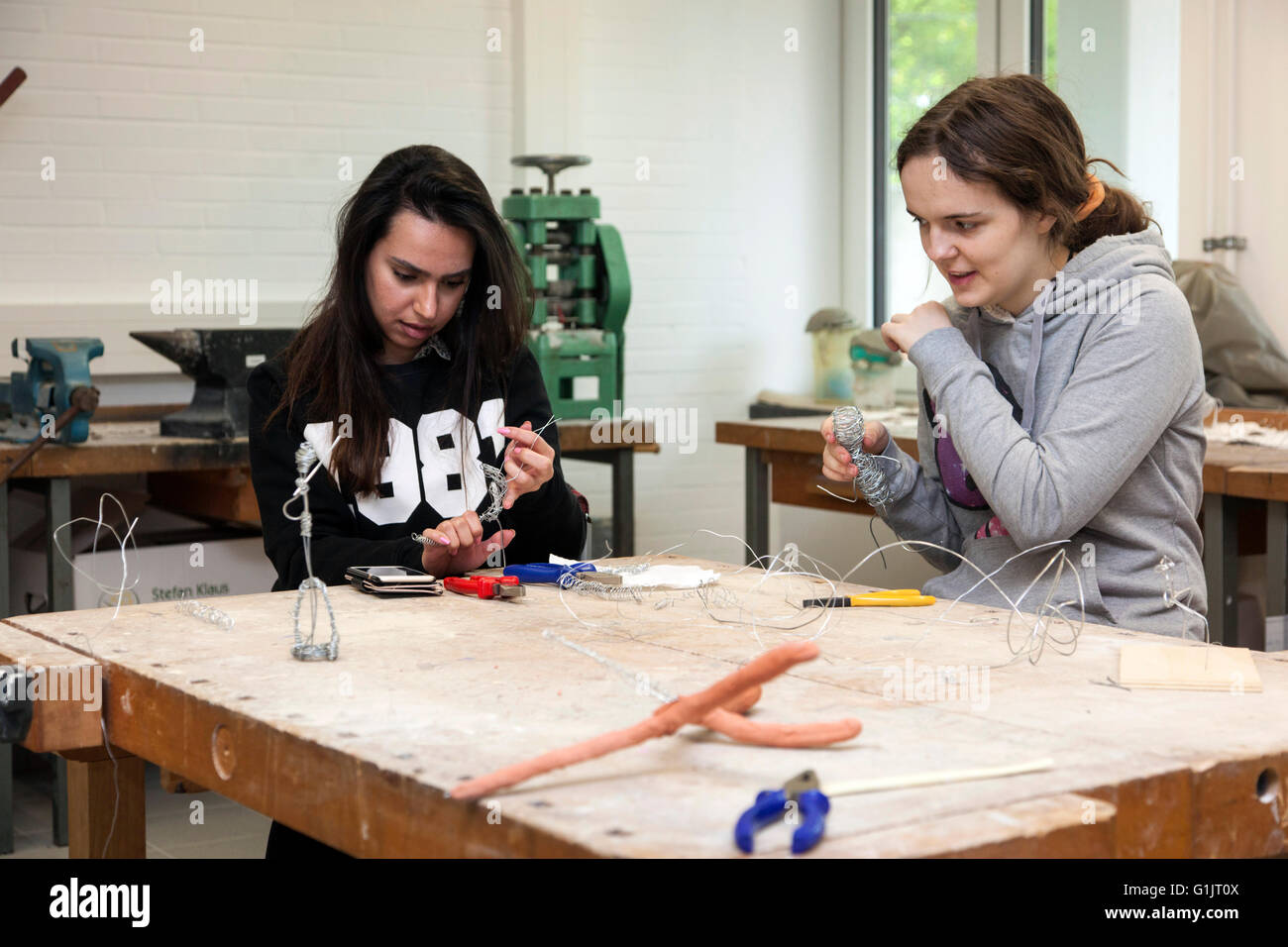 Students in art class create a work of art Stock Photo - Alamy