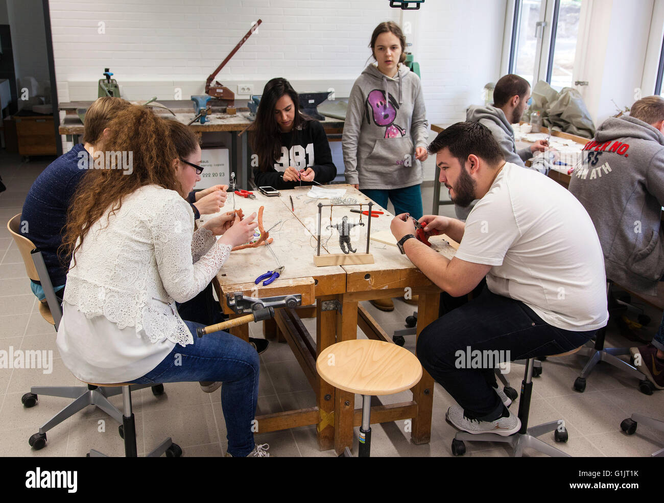 Students in art class create a work of art Stock Photo - Alamy