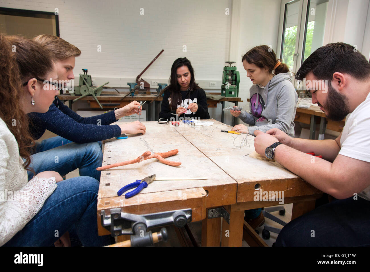 Students in art class create a work of art Stock Photo - Alamy