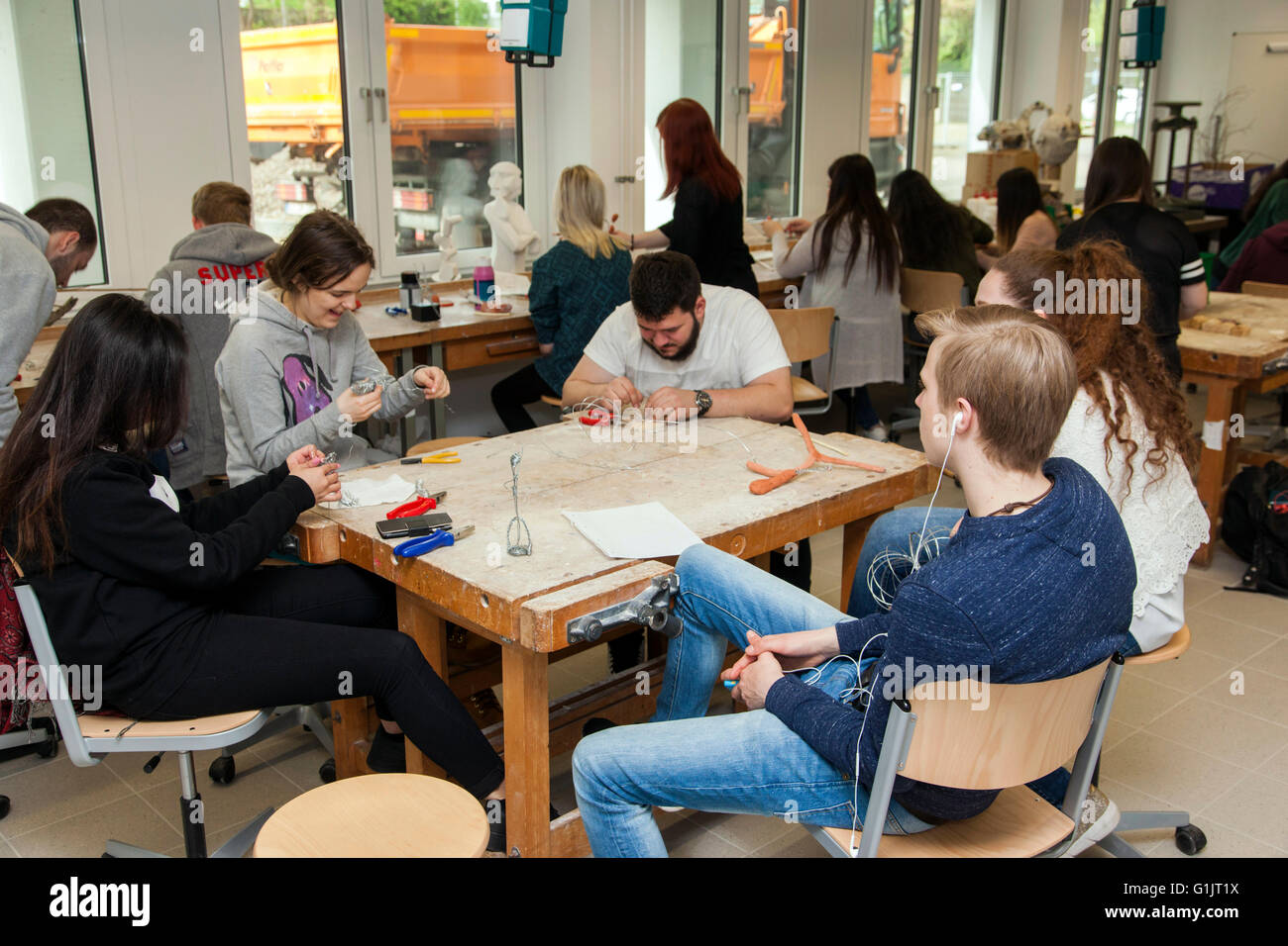 Students in art class create a work of art Stock Photo - Alamy