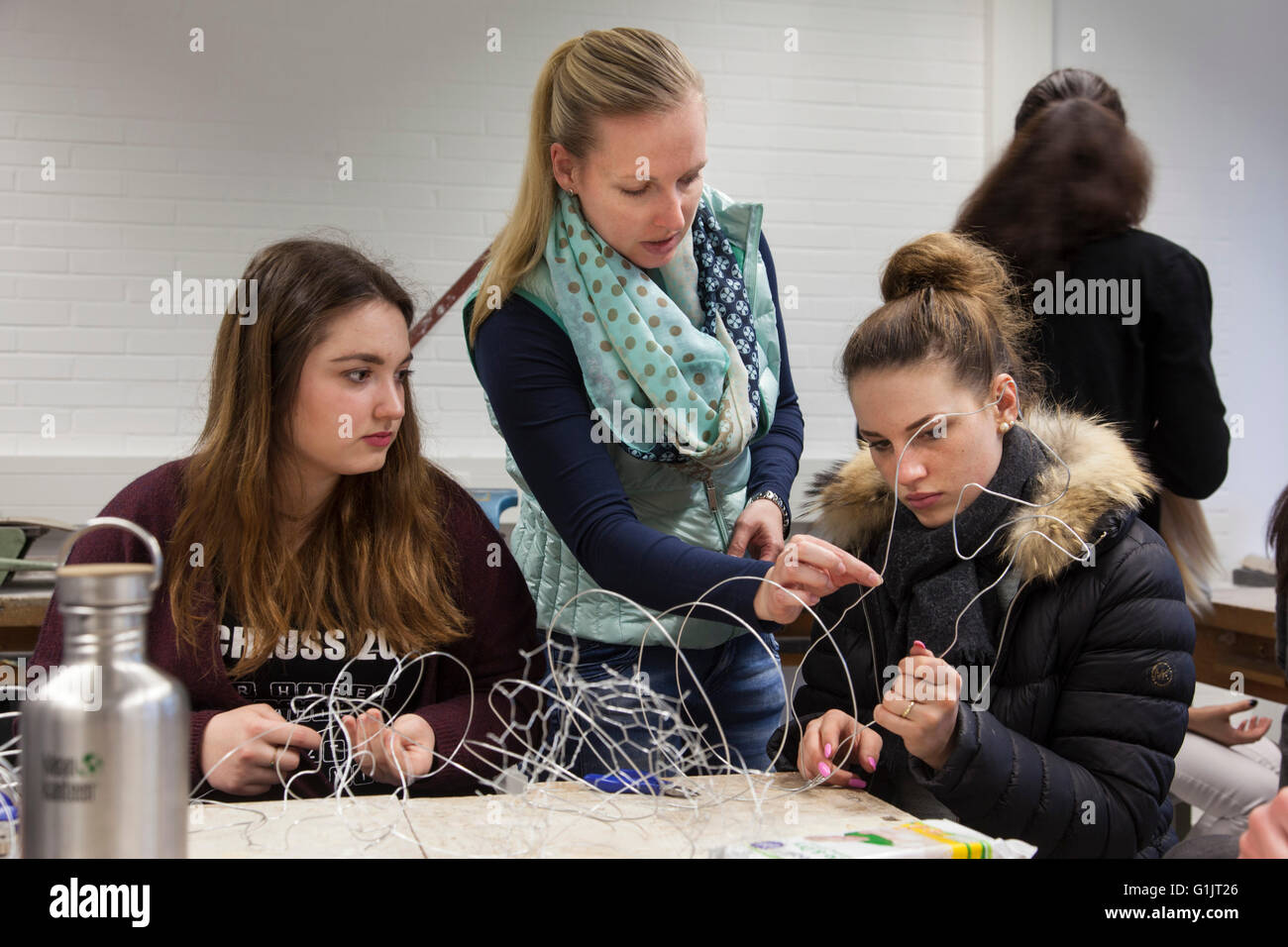 Students in art class create a work of art Stock Photo - Alamy