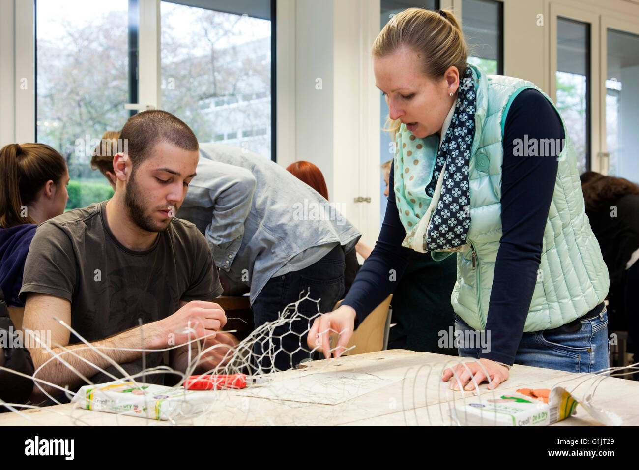 Students in art class create a work of art Stock Photo - Alamy