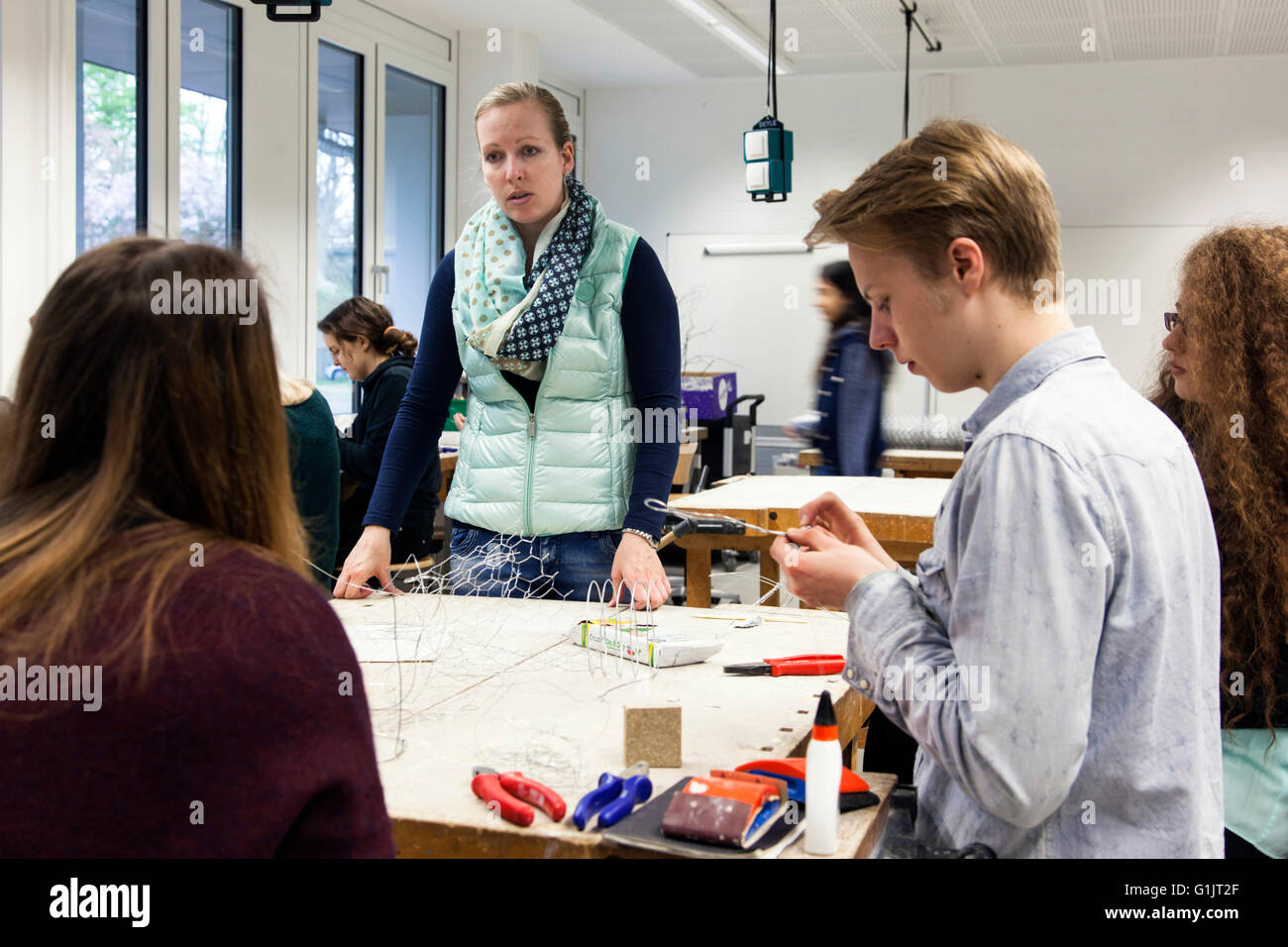 Students in art class create a work of art Stock Photo - Alamy