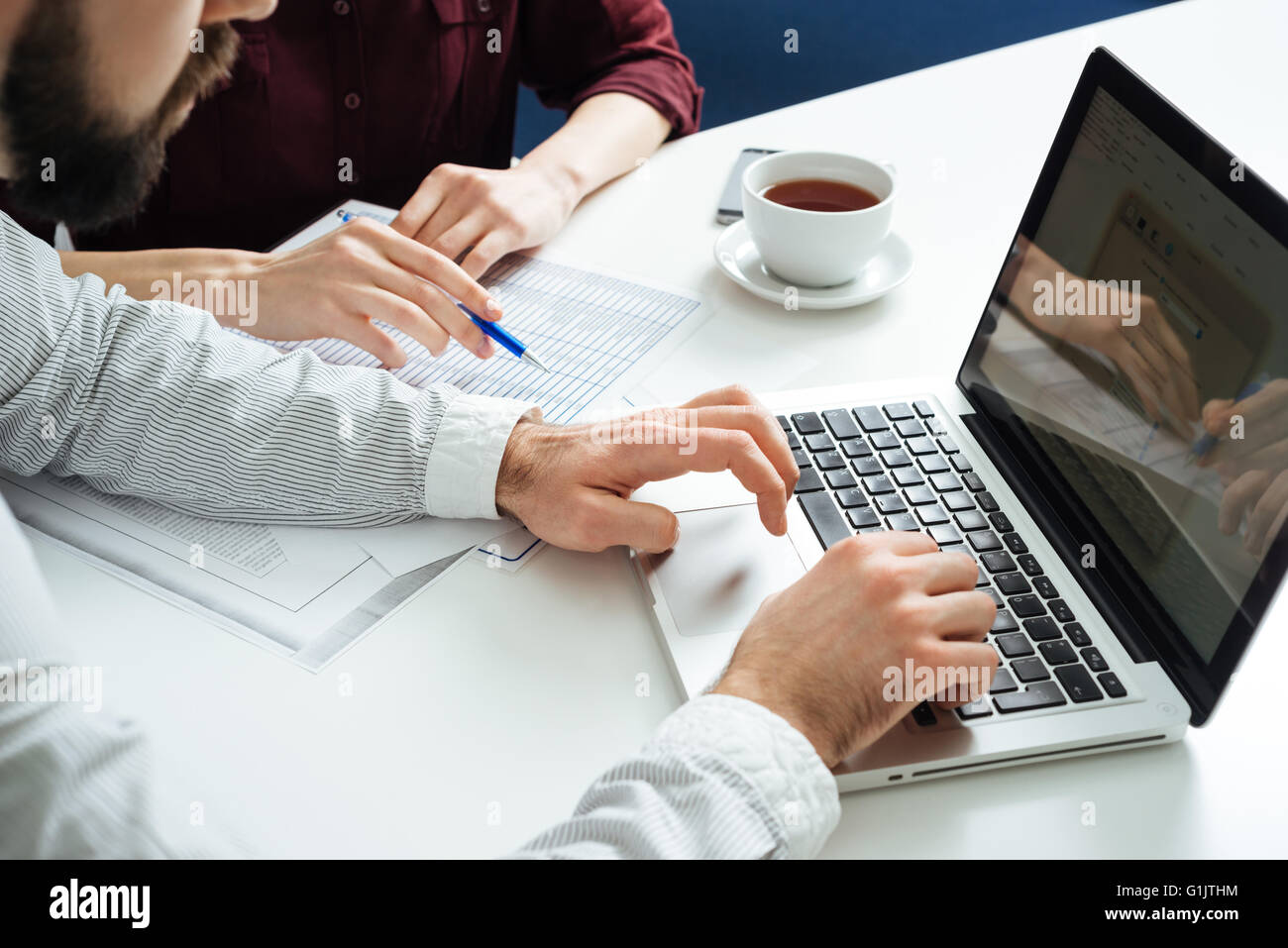 Two typing hands hi-res stock photography and images - Alamy