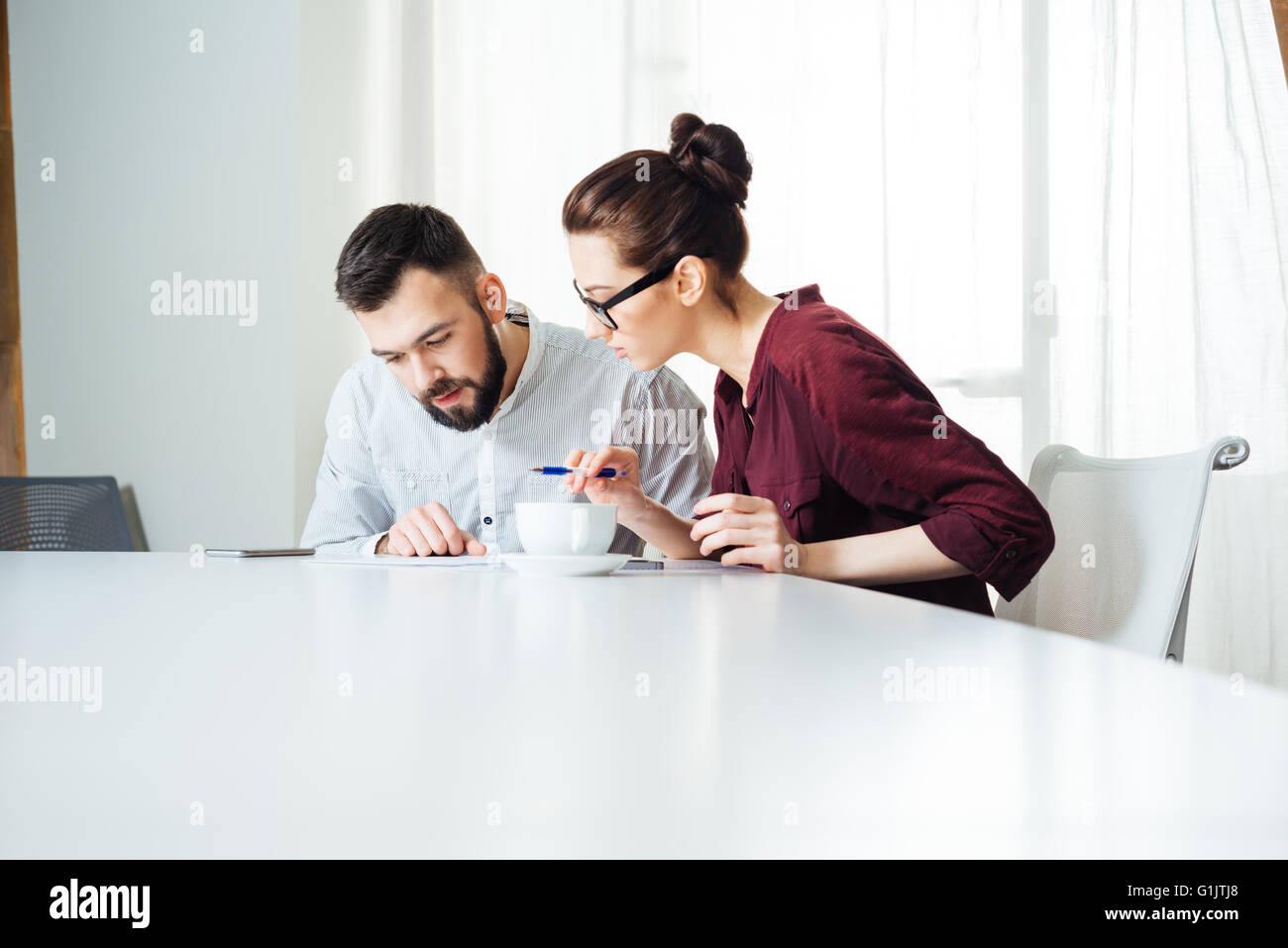 Concentrated young businesspeople working hi-res stock photography and ...