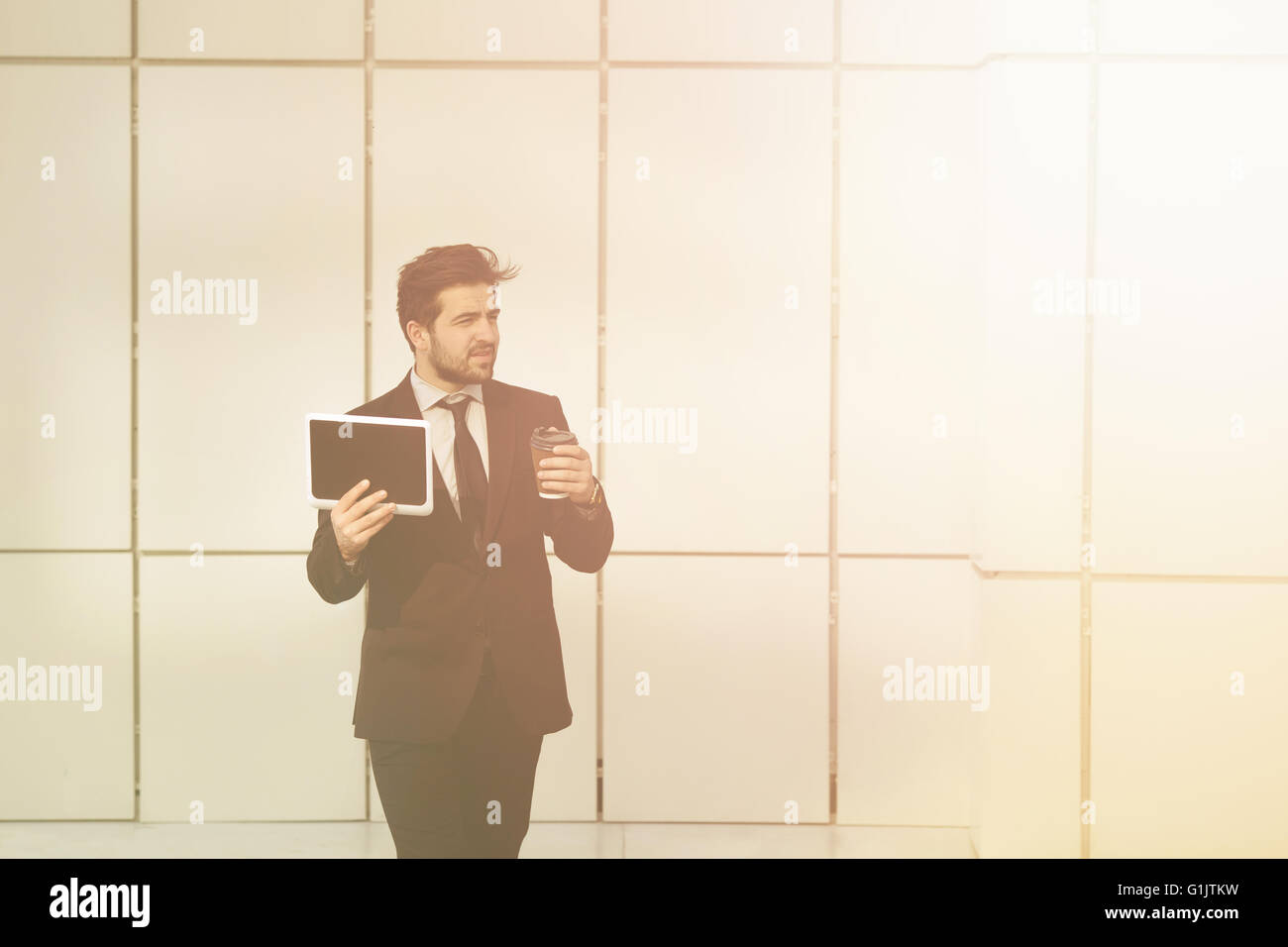 Walking with tablet hi-res stock photography and images - Alamy