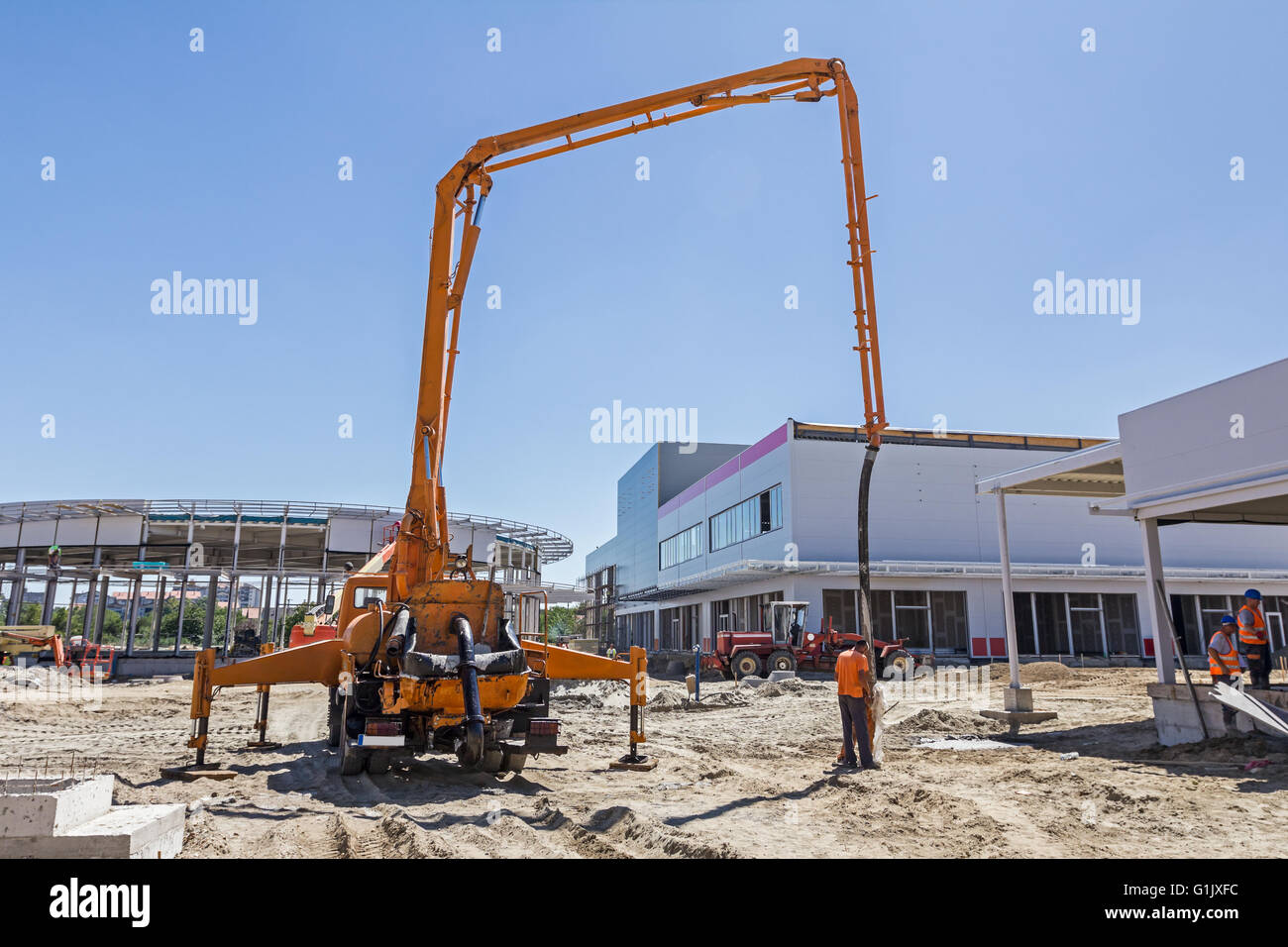 Construction workers are preparing pump for concrete for pouring Stock ...