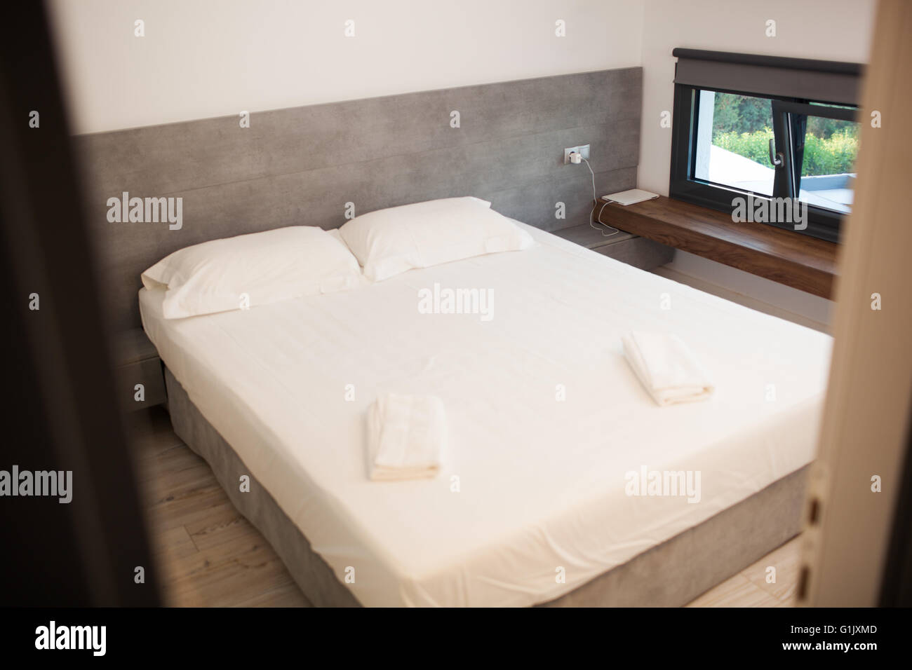 Empty hotel room for two with matrimonial bed Stock Photo - Alamy