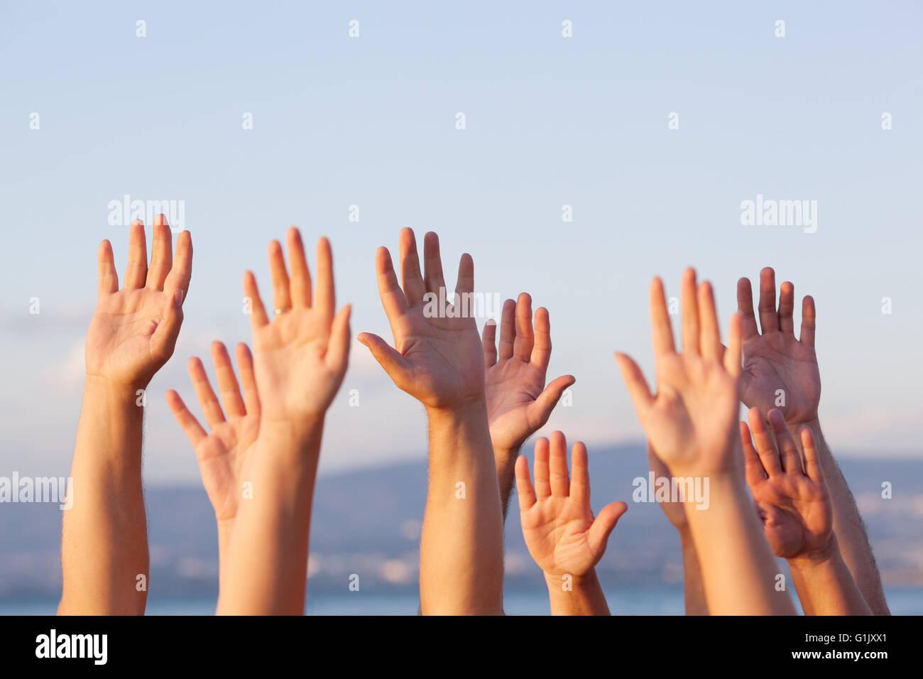 Unrecognizable people pulling hands in the air Stock Photo - Alamy