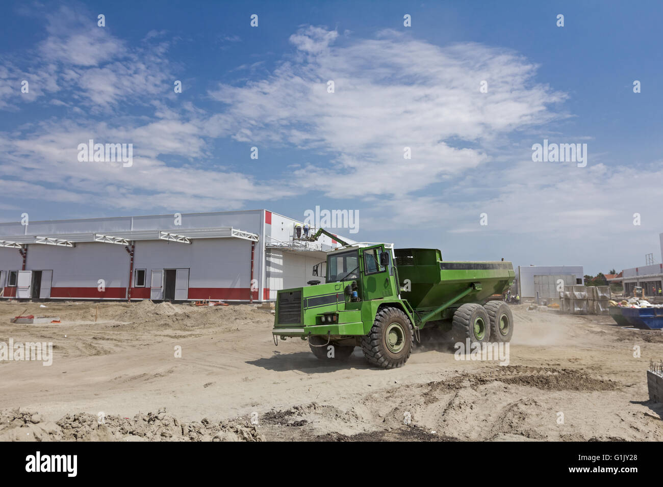 Dumper truck is going to unload soil or sand at construction site Stock ...