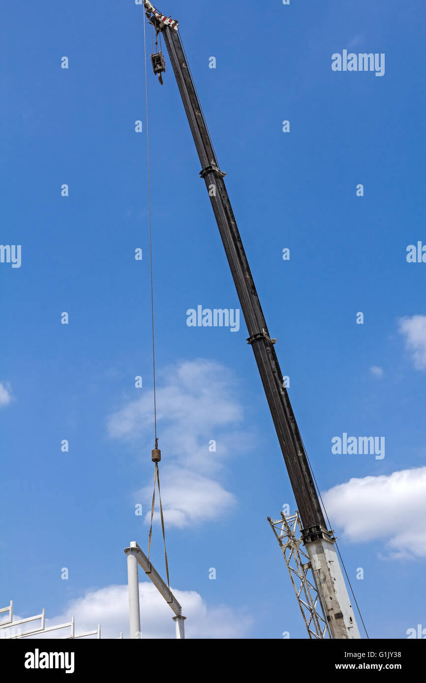 Skeleton of new assembled canopies is hanging on crane hook Stock Photo ...