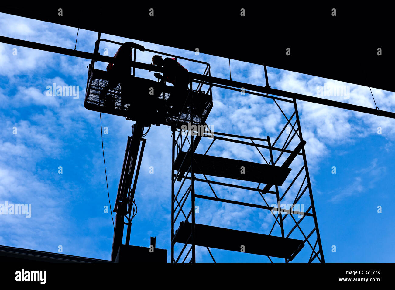 Construction workers in cherry picker hi-res stock photography and ...