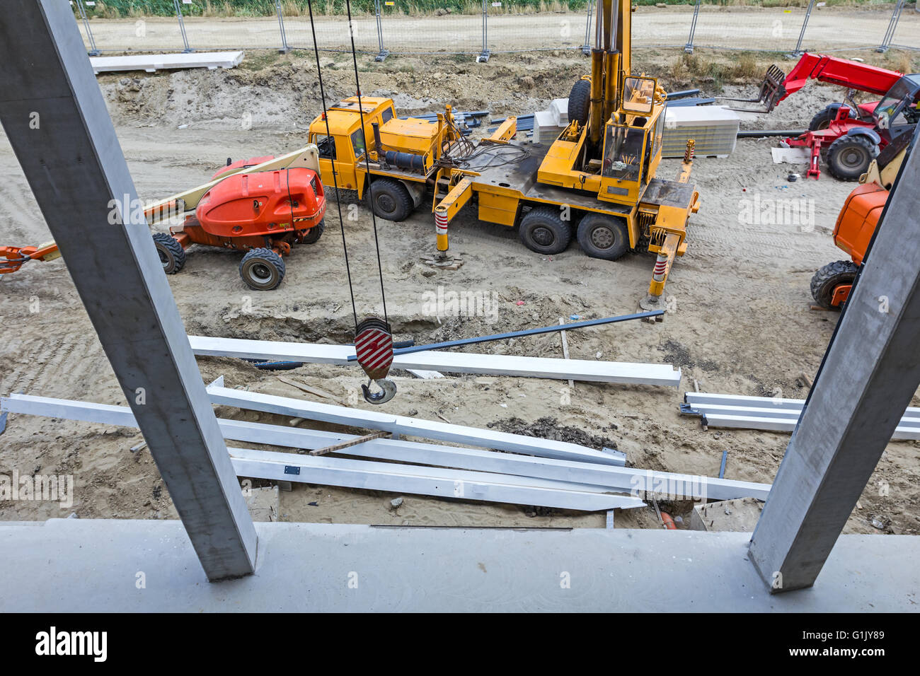 View above on mobile crane and other construction machinery resting at ...
