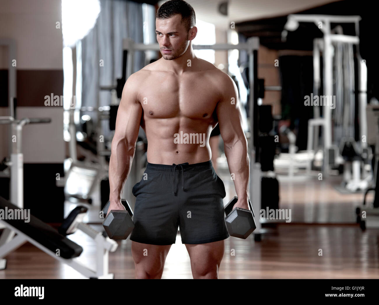 Muscular male bodybuilder in gym hi-res stock photography and images ...