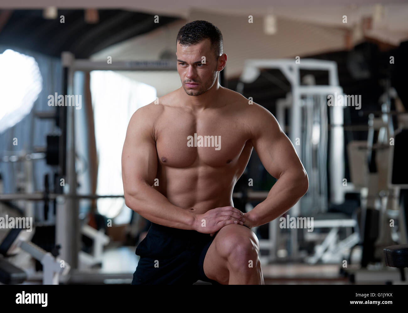 handsome young muscular man in a fitness gym Stock Photo - Alamy
