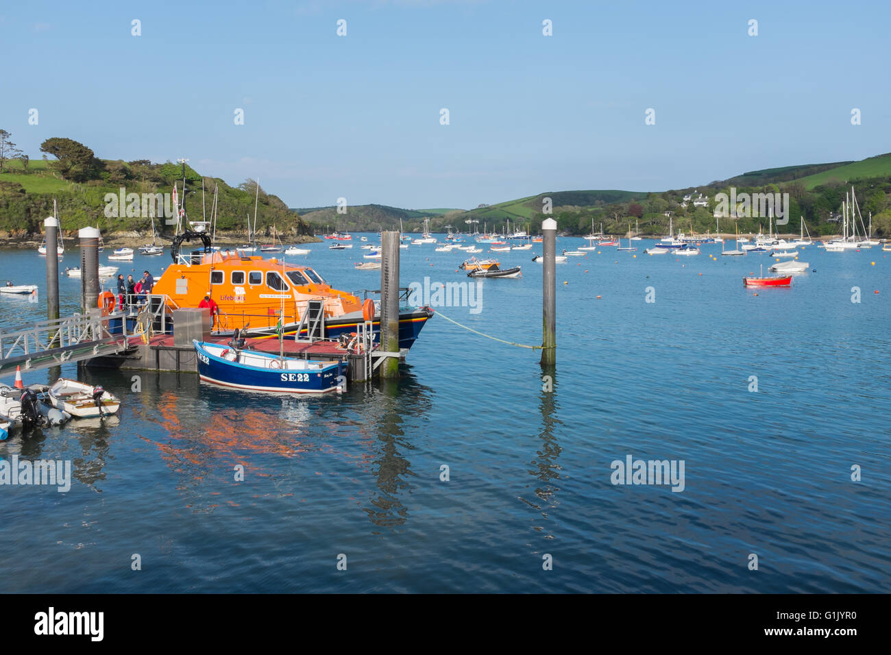 Salcombe Estuary in bright sunlight with RNLI Lifeboat moorted on ...