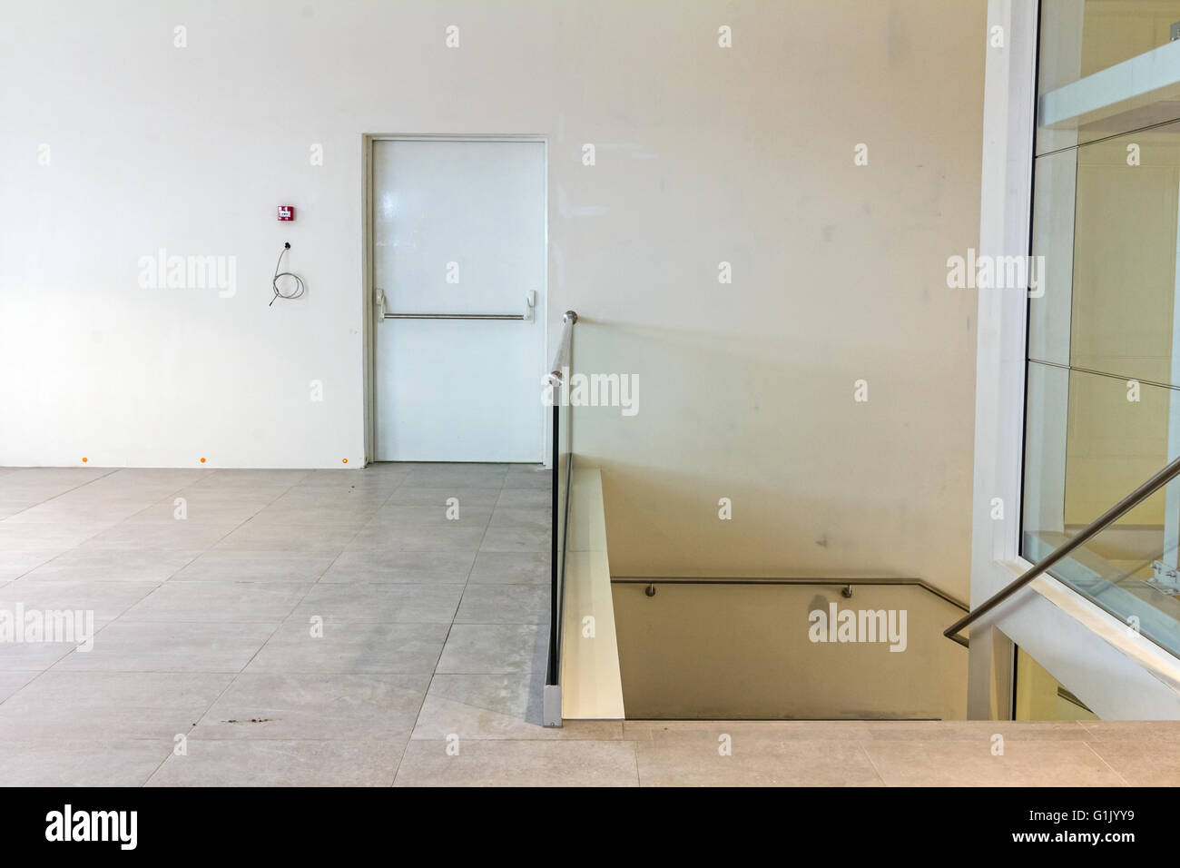 Fire exit door are going from large exhibition hall Stock Photo - Alamy