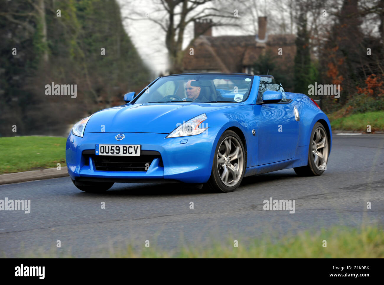 Nissan 370Z convertible Japanese sports car driving Stock Photo - Alamy
