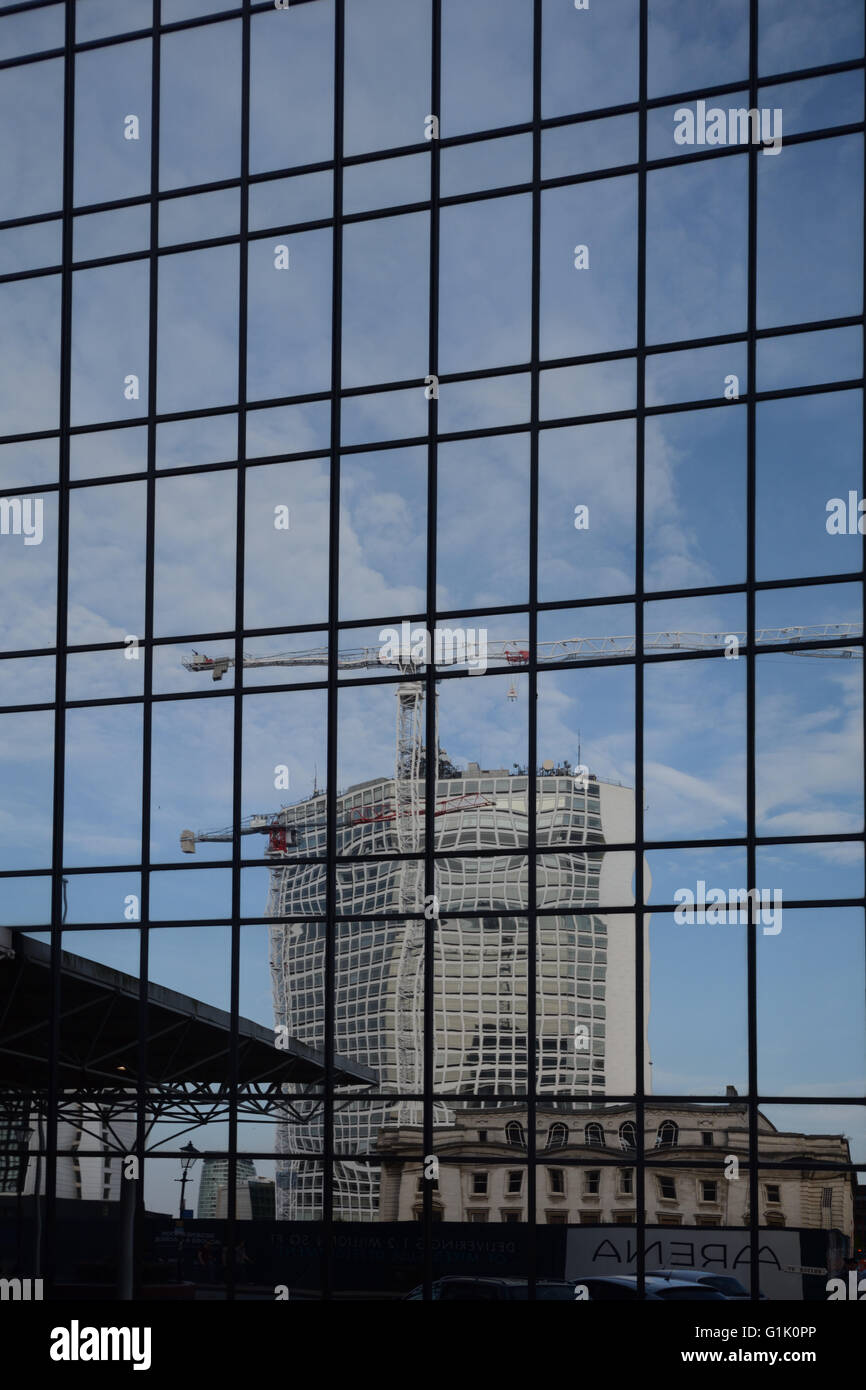 Reflection of Alpha Tower, in windows of Hyatt Regency Hotel Stock ...