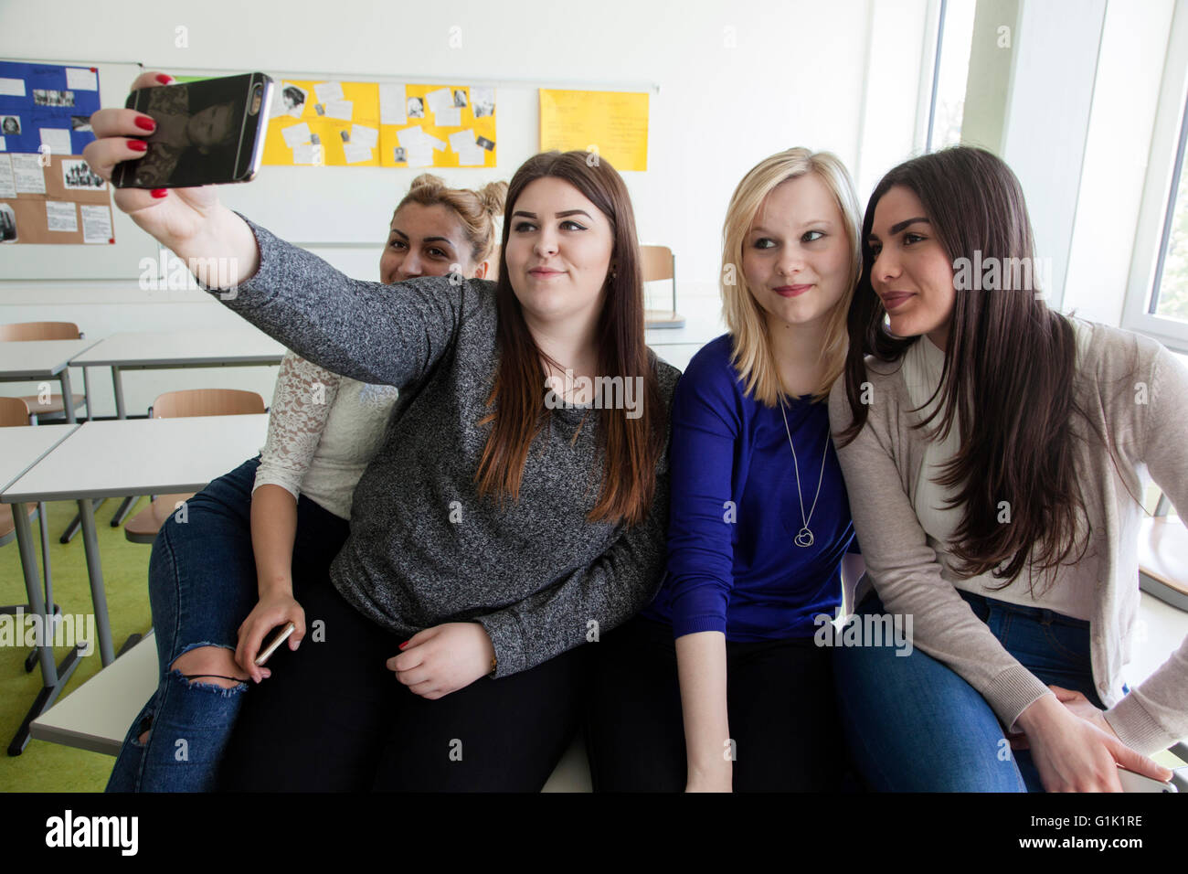 The head-down generation is on working with their smartphone Stock ...