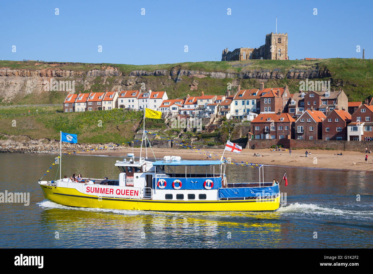 A boat setting sail for the North Sea from Whitby Harbour Stock Photo ...