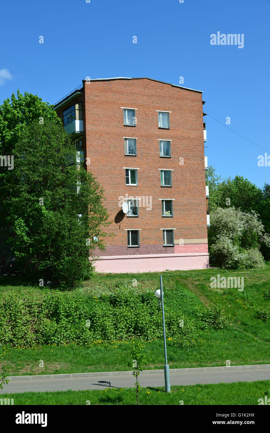 Old five-story brick house Stock Photo - Alamy