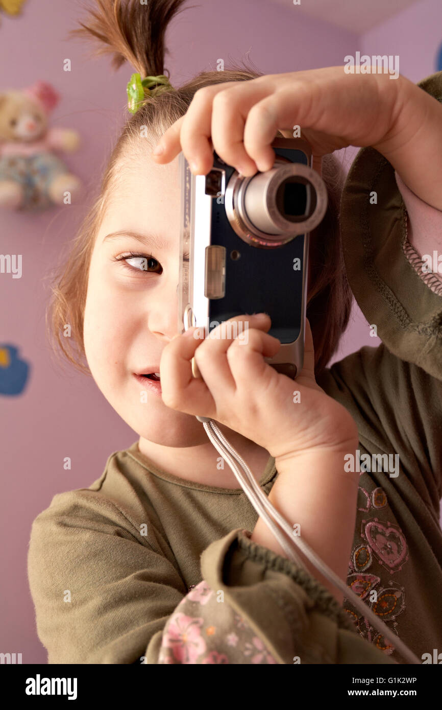 Baby with digital camera Stock Photo - Alamy